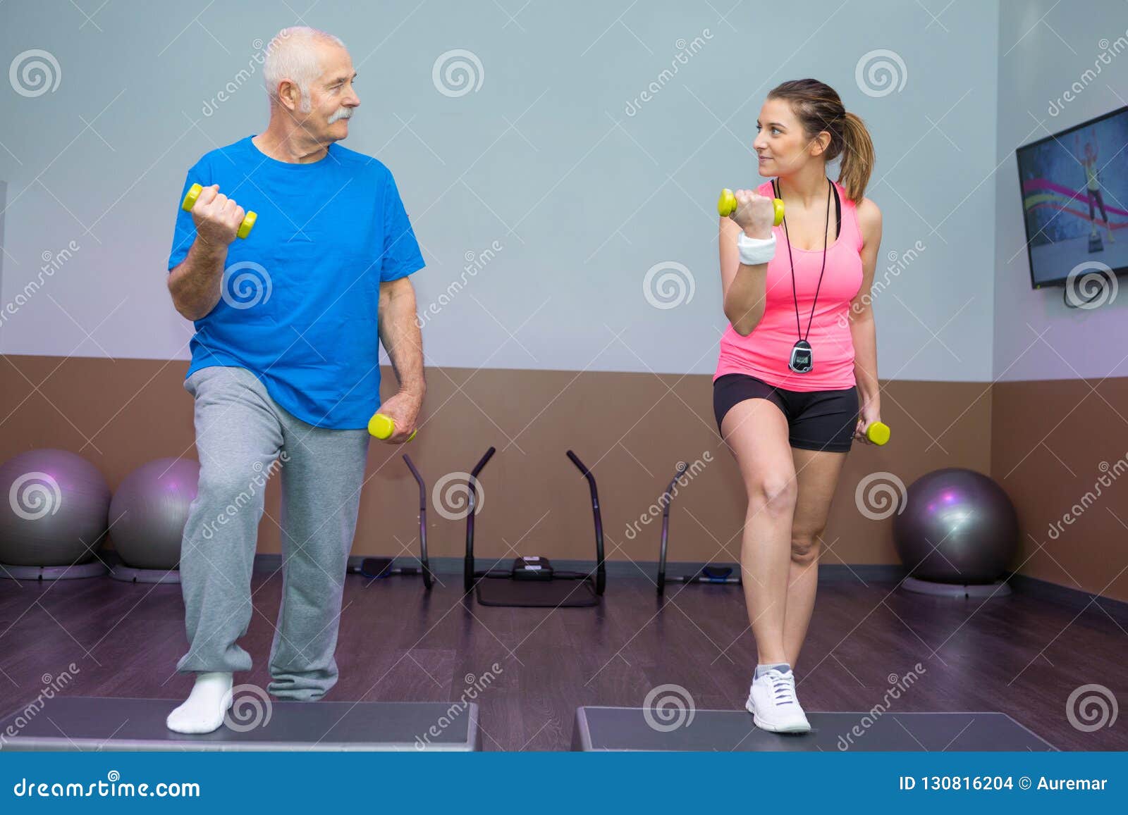Senior Man with Physio Using Step and Weights Stock Photo - Image of ...