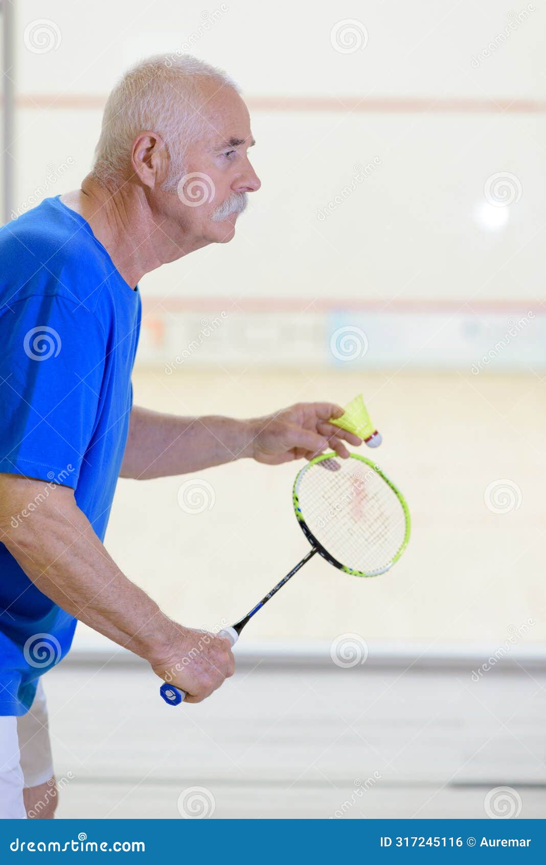 Senior Man Playing Badminton in Court Stock Photo - Image of ...