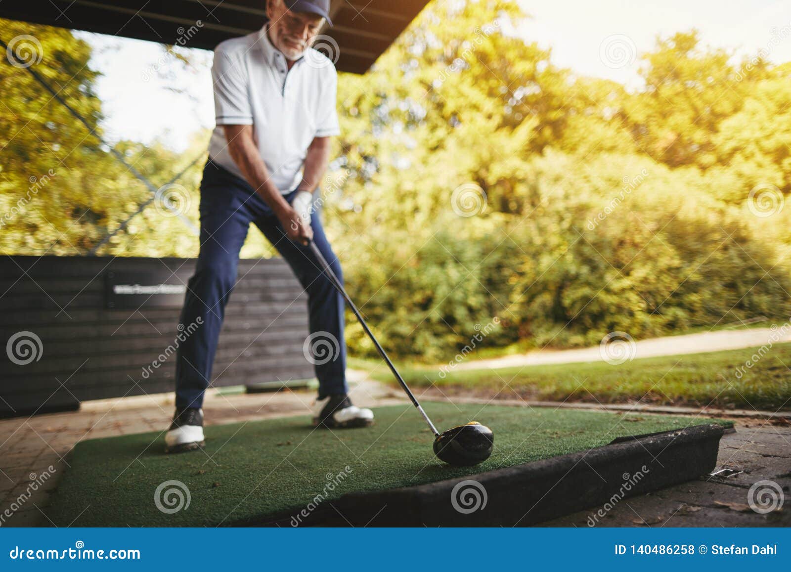 Senior Man Practicing His Golf Swing at a Driving Range Stock Photo ...