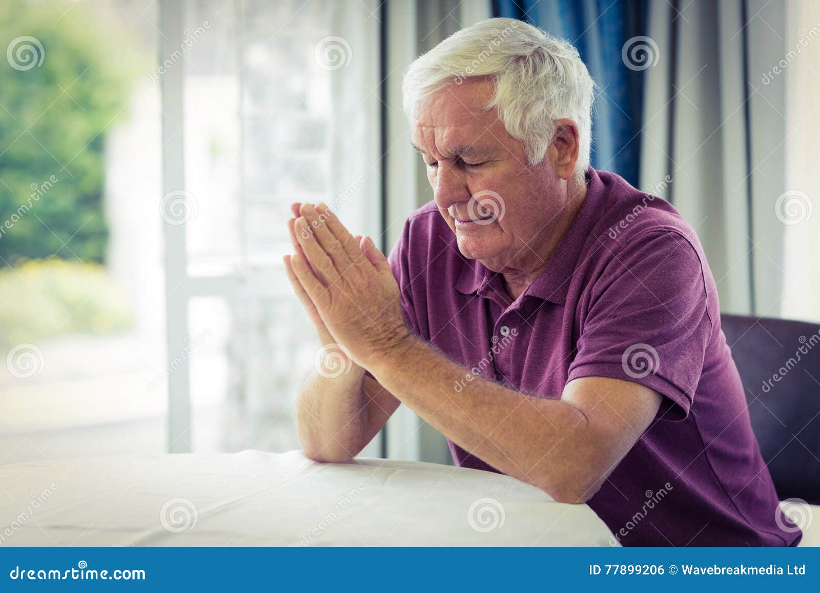Senior Man Praying in Living Room Stock Photo - Image of living, closed ...