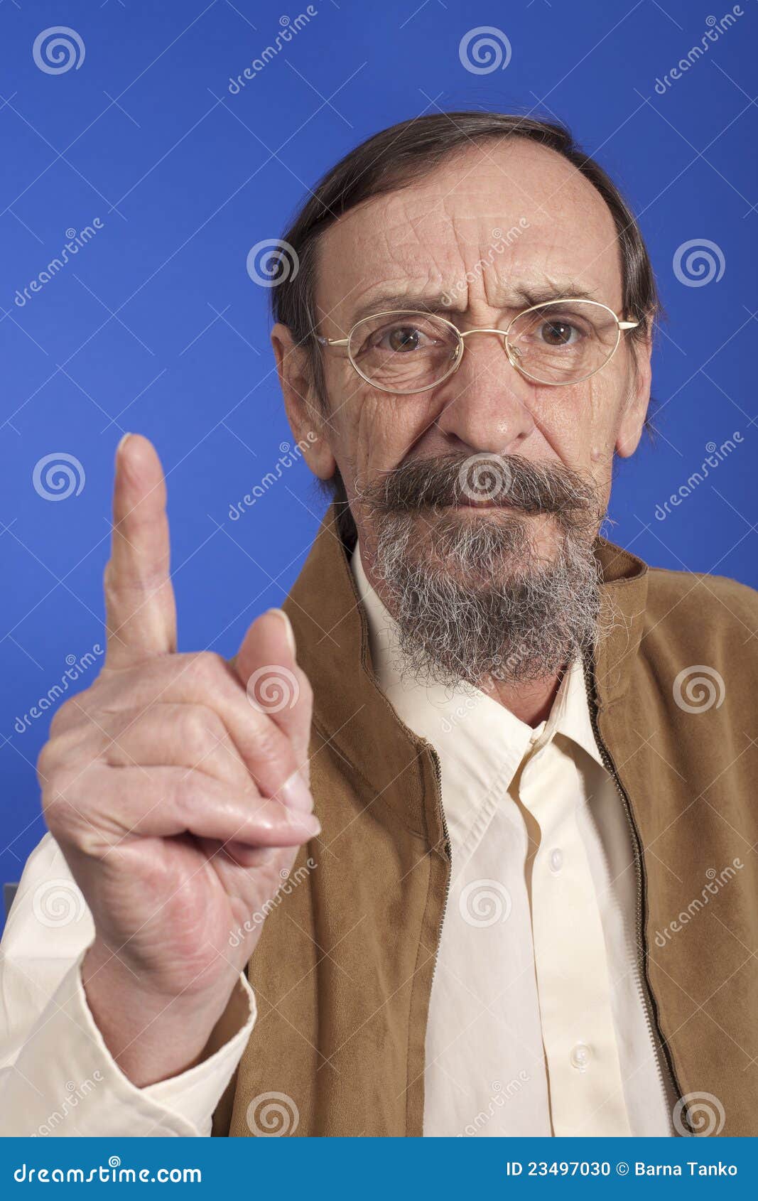 Senior man raising finger stock photo. Image of senior - 23497030