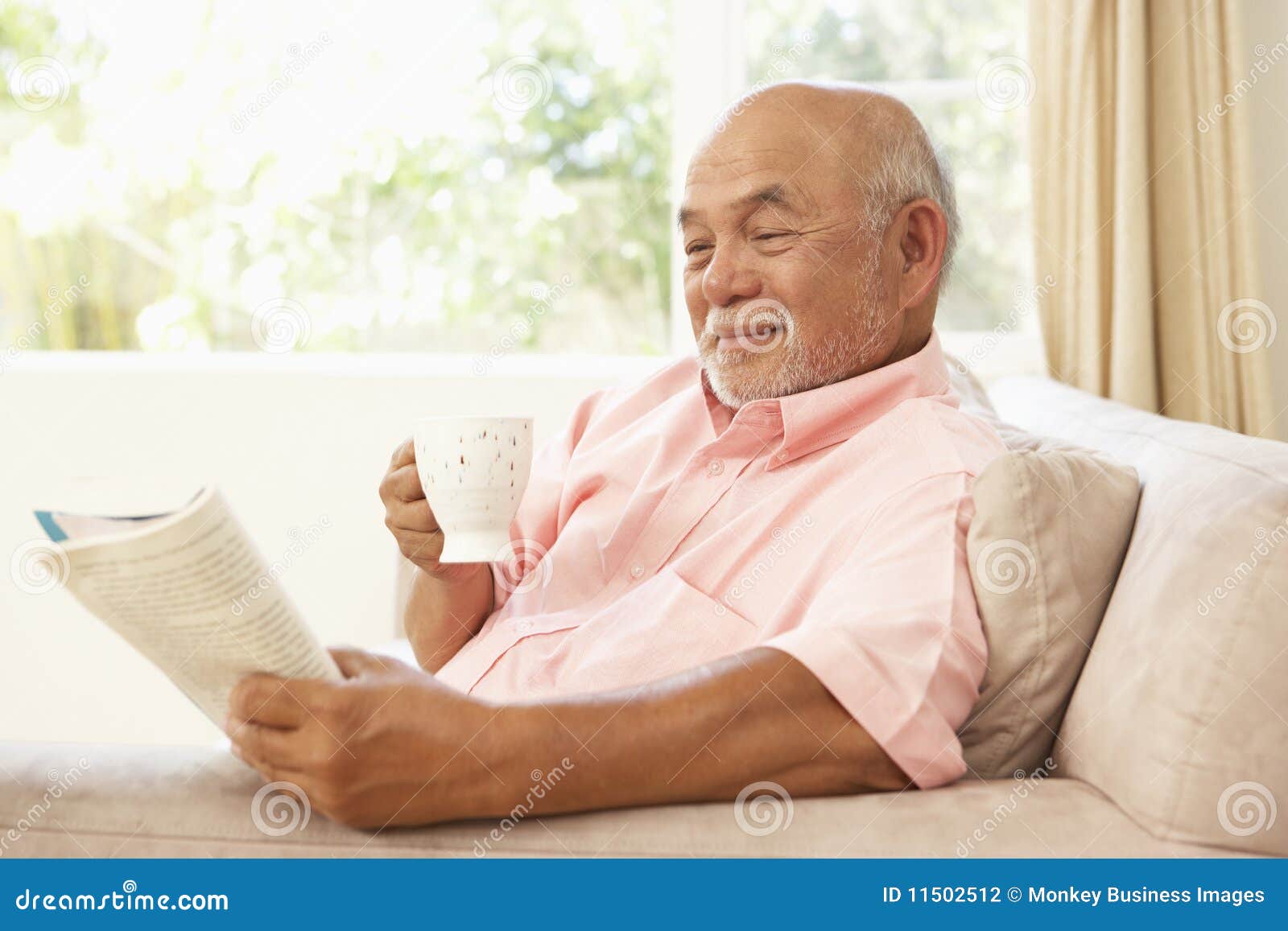 Senior Man Reading Book with Drink at Home Stock Photo - Image of ...