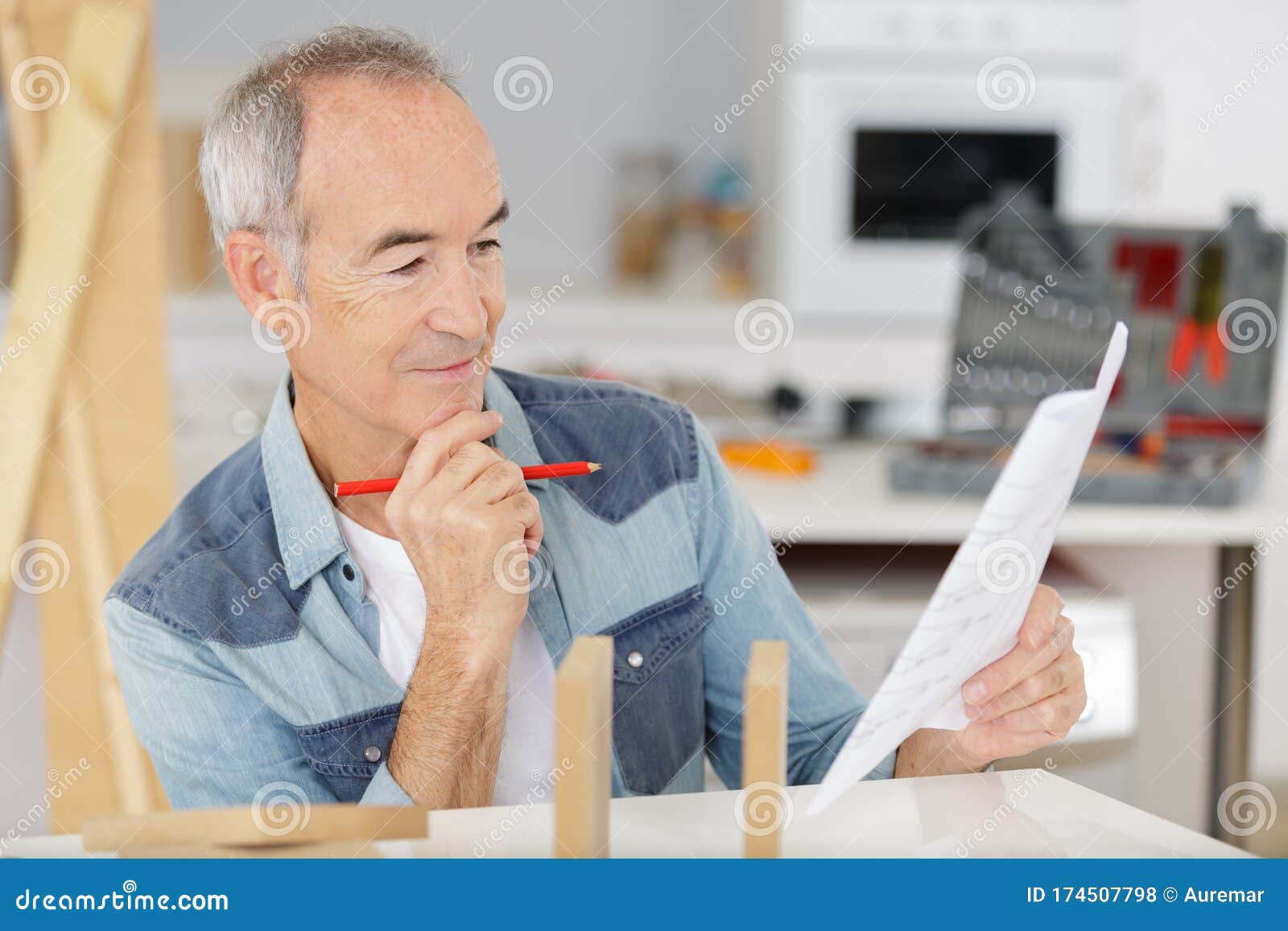 Senior Man Reading Instruction Stock Photo - Image of handyman, power ...