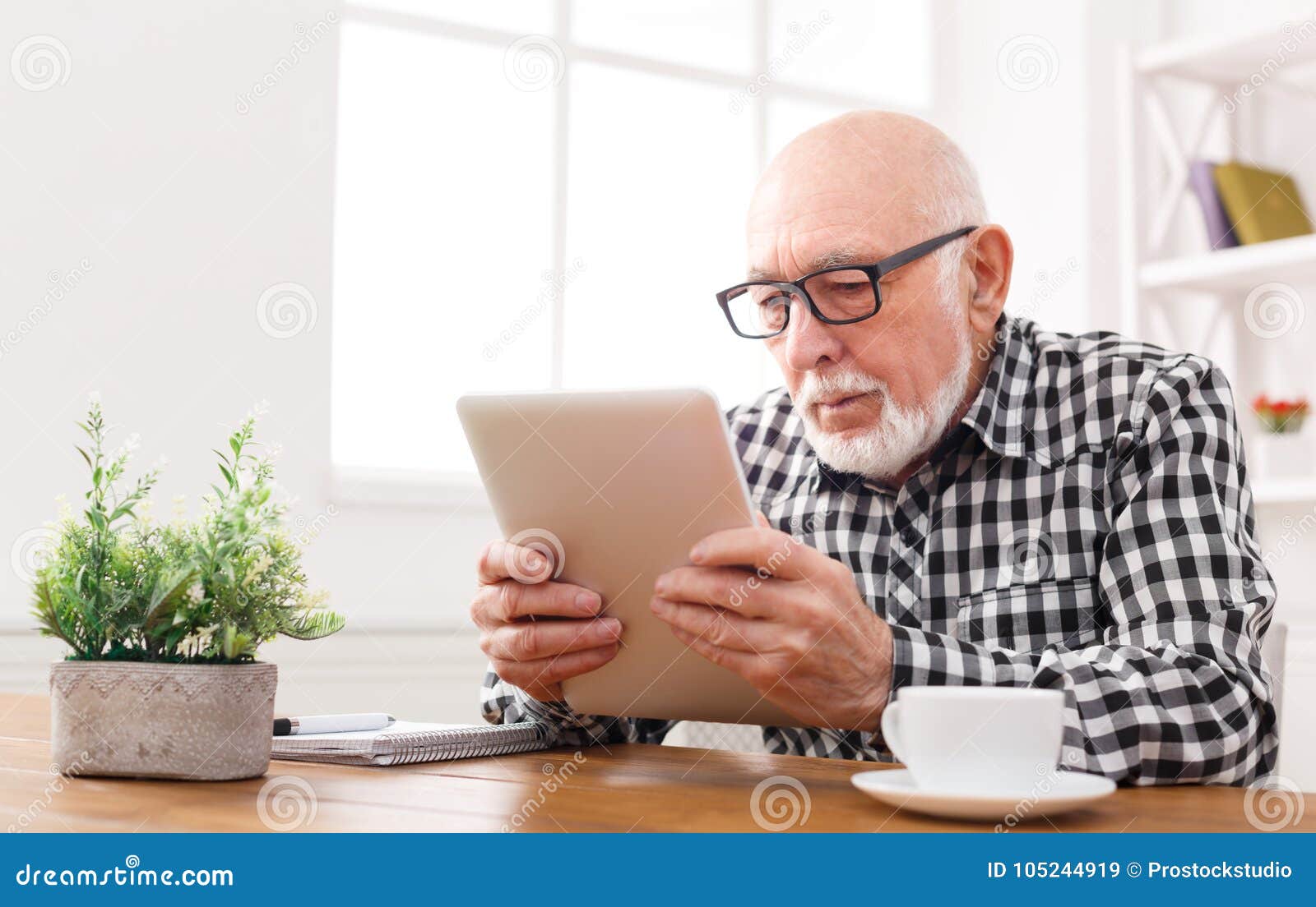 Senior Man Reading News on Digital Tablet Stock Image - Image of ...