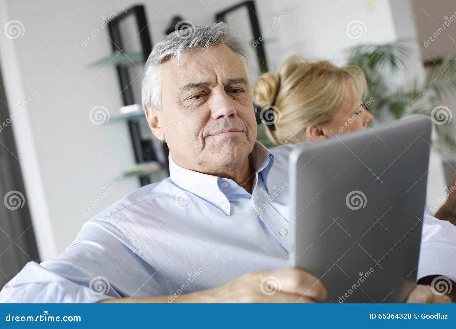 Senior Man Reading News on Tablet Stock Photo - Image of book, handsome ...