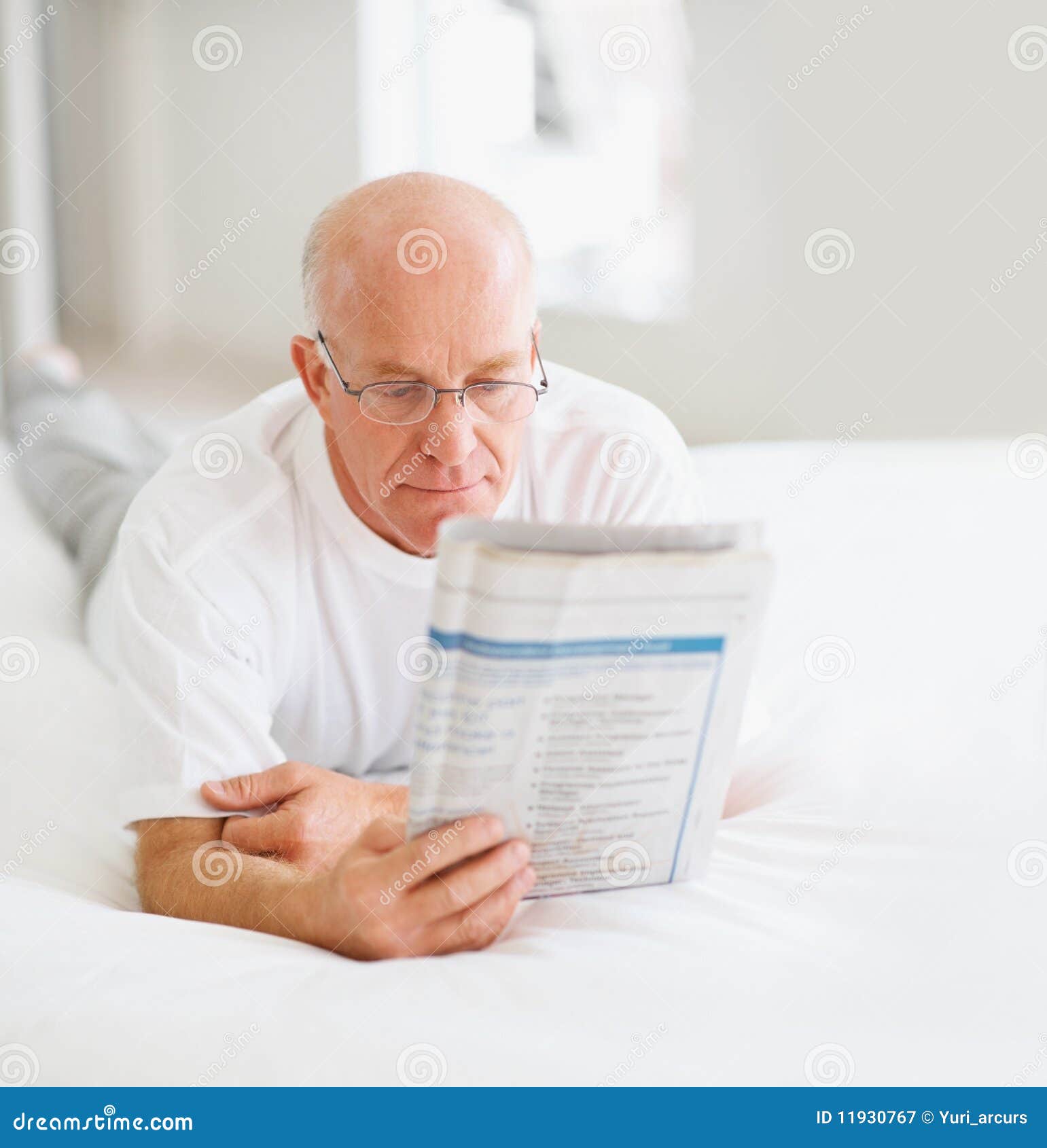 Senior Man Reading a Newspaper on Bed at Home Stock Image - Image of ...