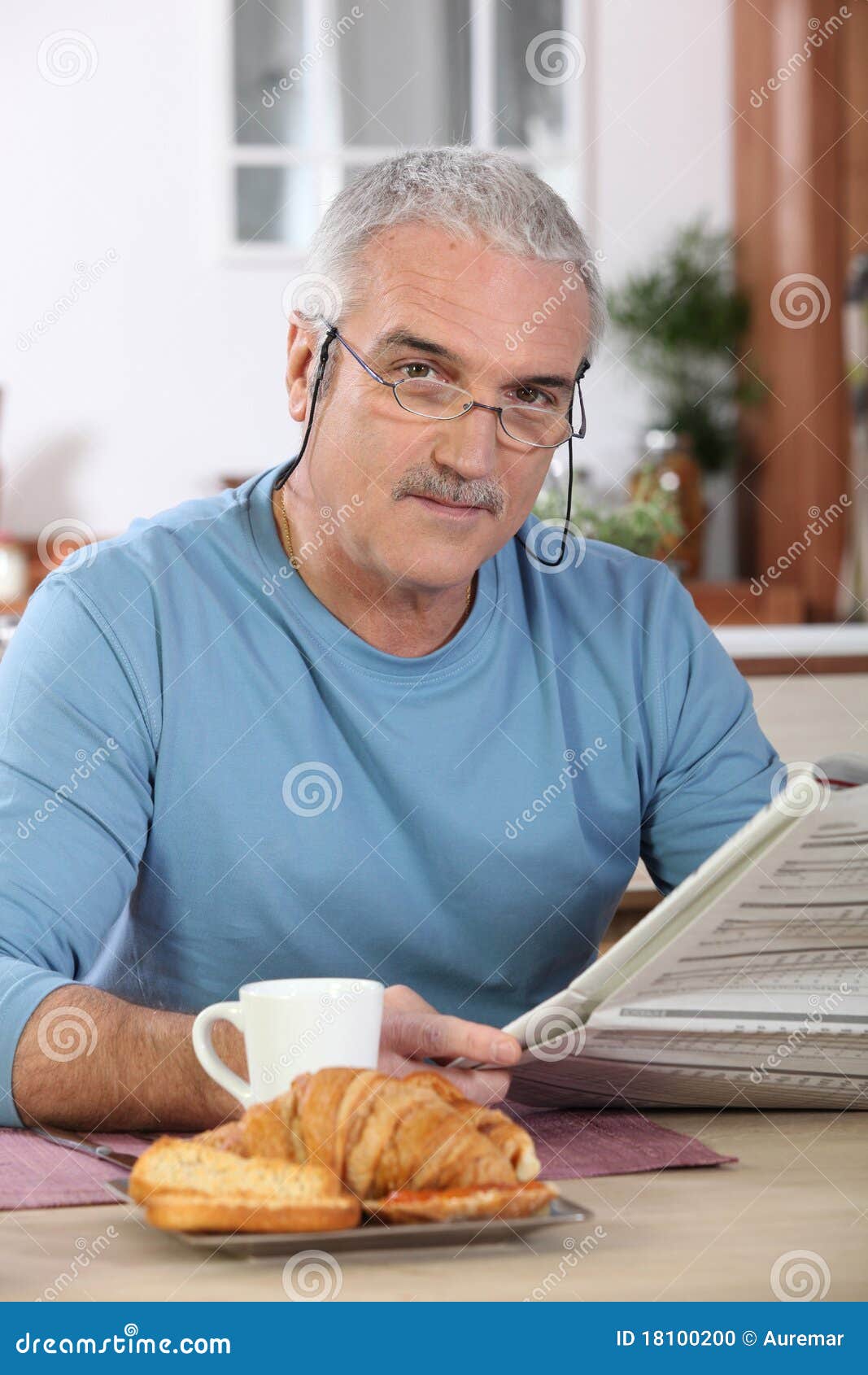 Senior Man Reading Newspaper at Breakfast Stock Photo - Image of ...