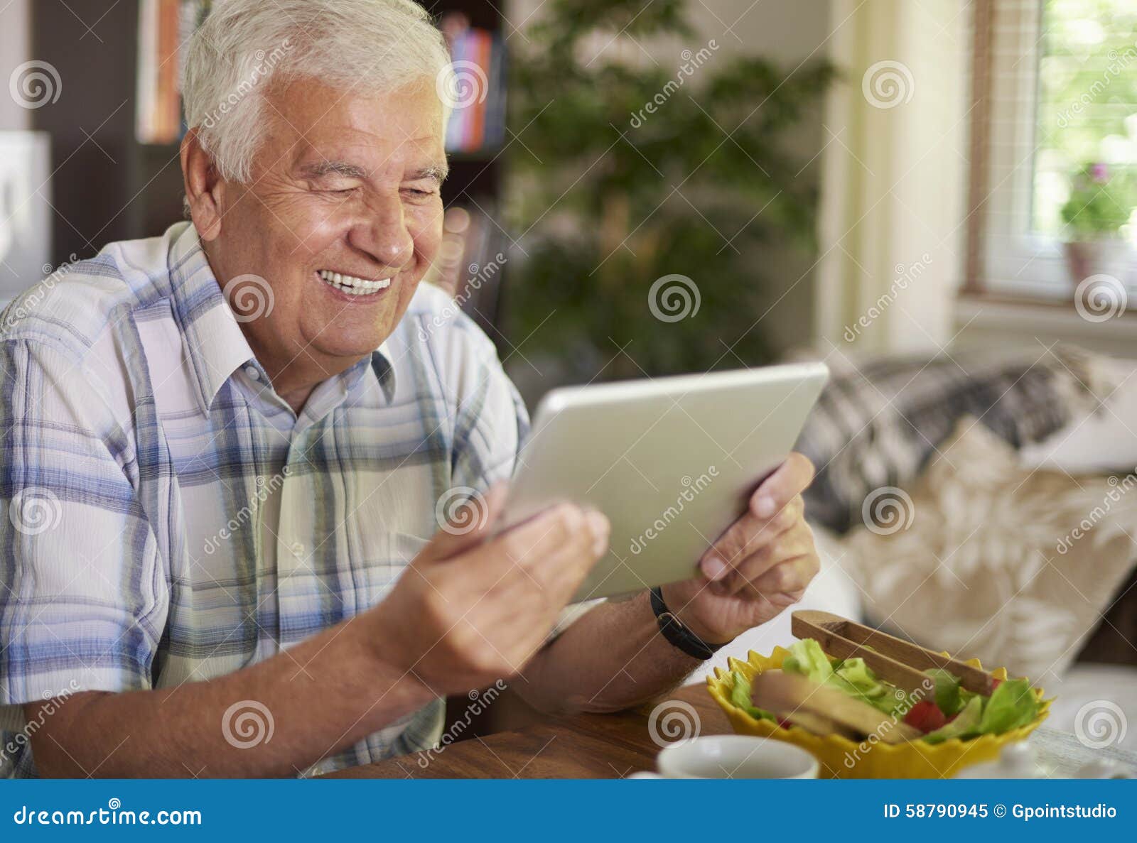 Senior Man Reading Online Article Stock Image - Image of gray, adult ...