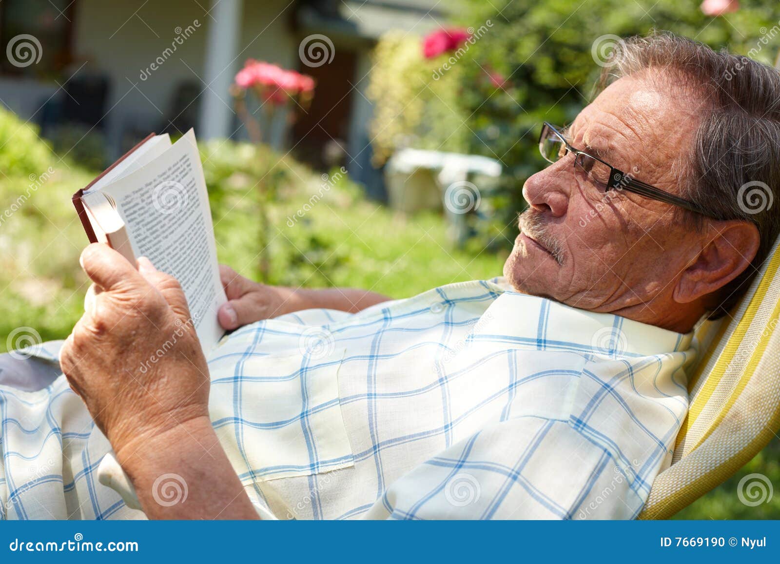 Senior man reading outdoor stock photo. Image of grandfather - 7669190