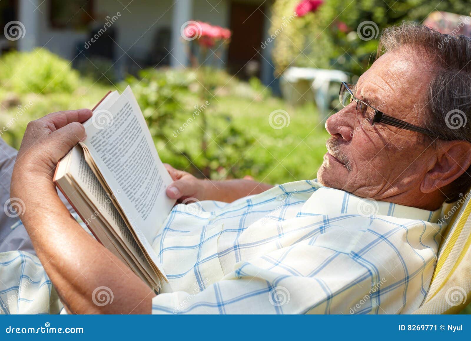 Senior man reading outdoor stock image. Image of face - 8269771