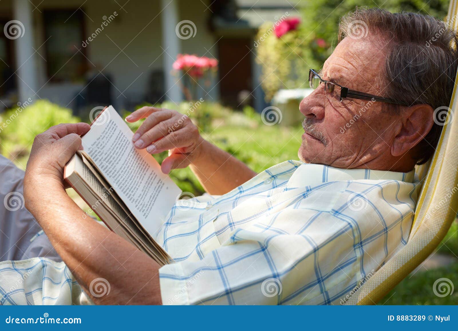 Senior man reading outdoor stock image. Image of maturity - 8883289