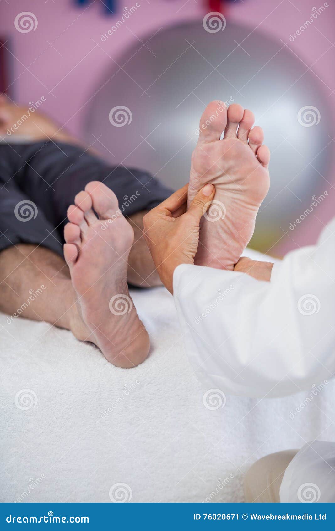 Senior Man Receiving Foot Massage From Physiotherapist Stock Image