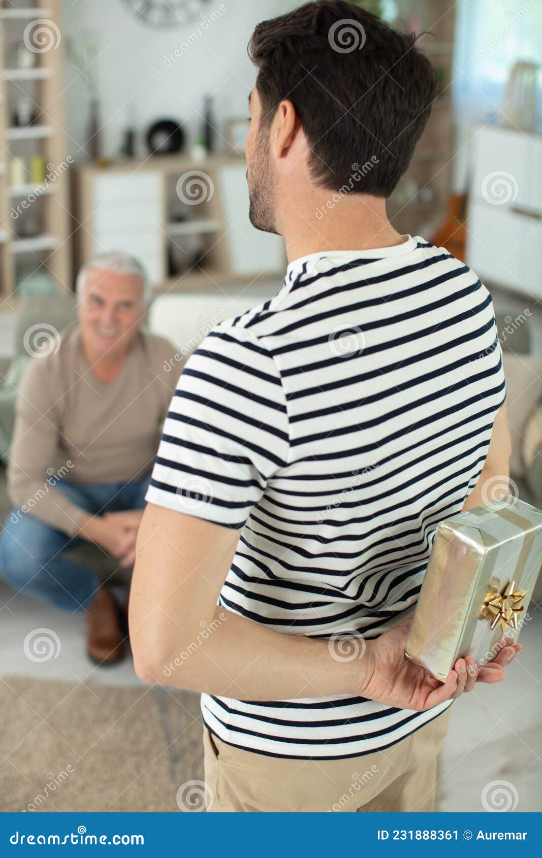 Senior man receiving gift stock image. Image of card - 231888361