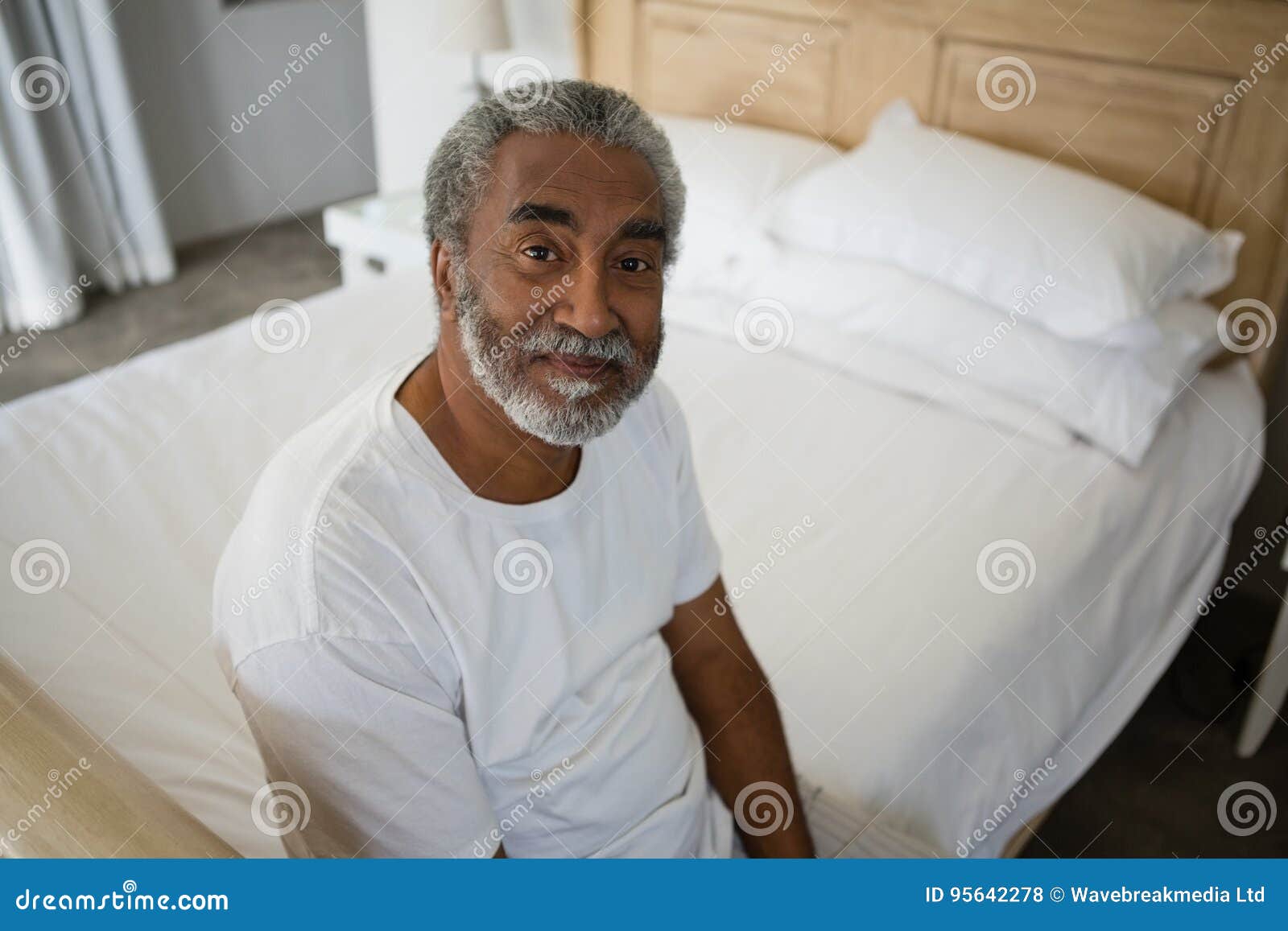 Senior Man Relaxing on Bed at Home Stock Photo - Image of nightwear ...