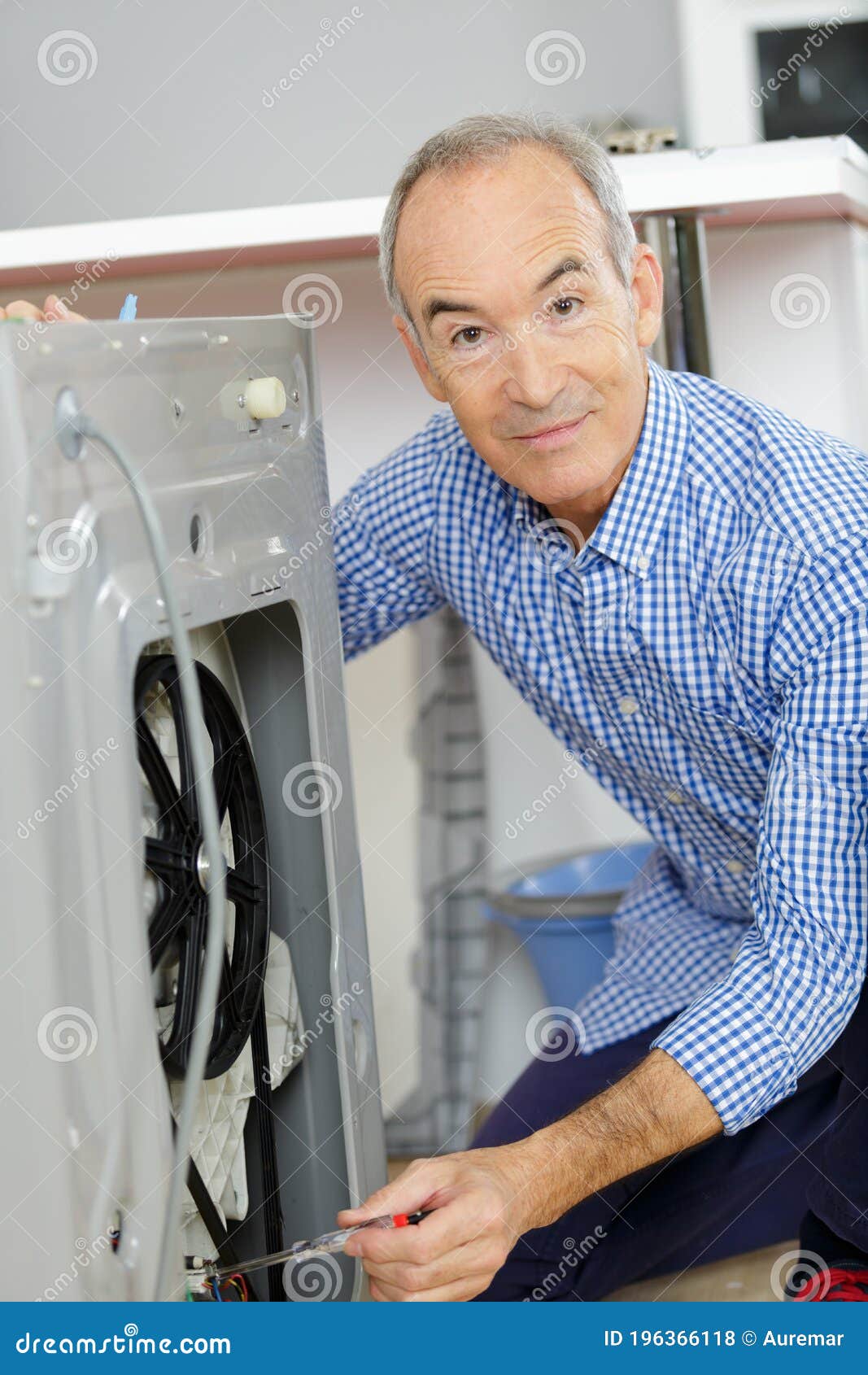 Senior Man Repairing Washing Machine Stock Photo - Image of caucasian ...