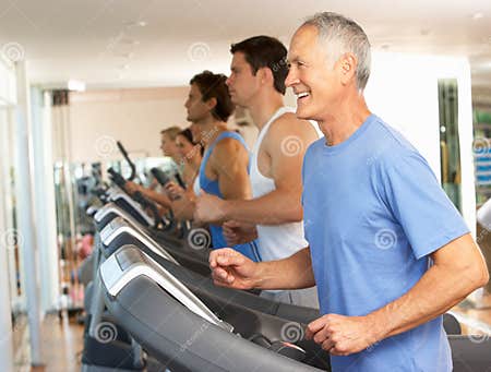 Senior Man on Running Machine Stock Image - Image of sixties, class ...
