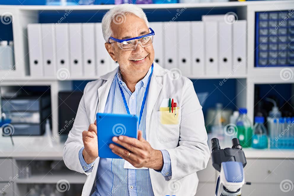 Senior Man Scientist Using Touchpad Working at Laboratory Stock Photo ...