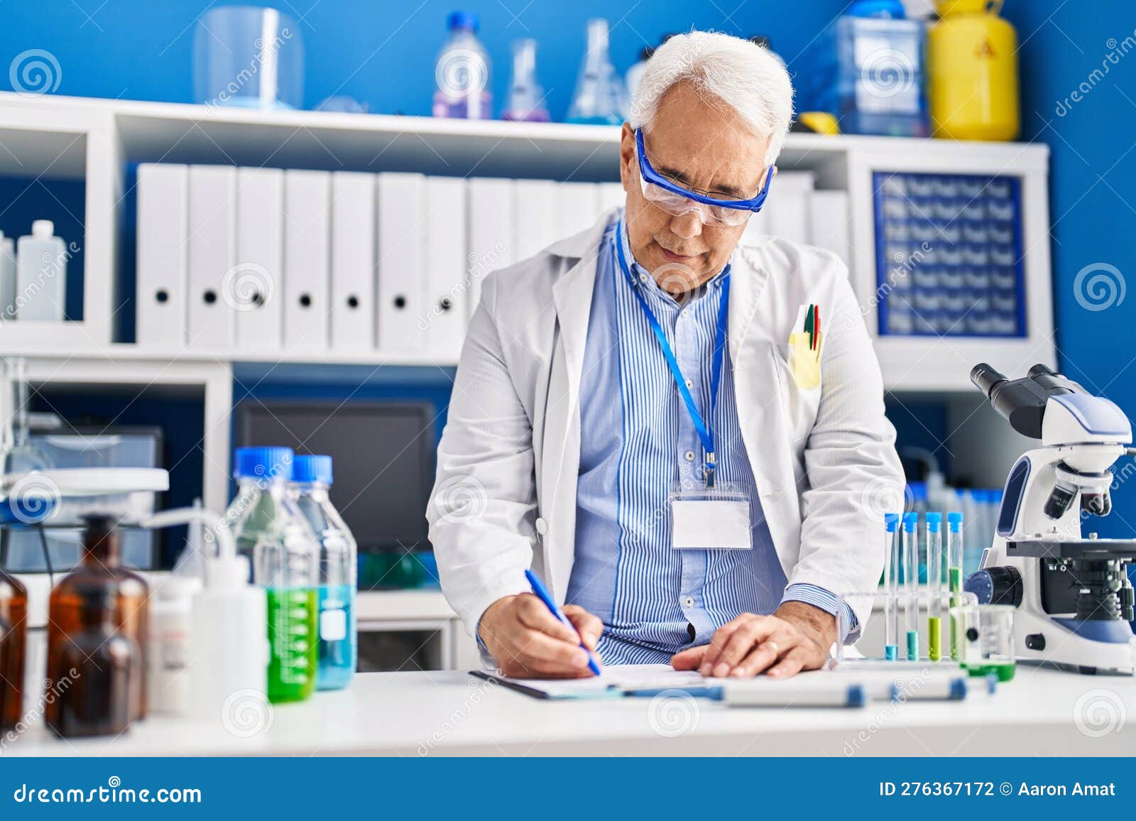 Senior Man Scientist Writing on Document at Laboratory Stock Photo ...