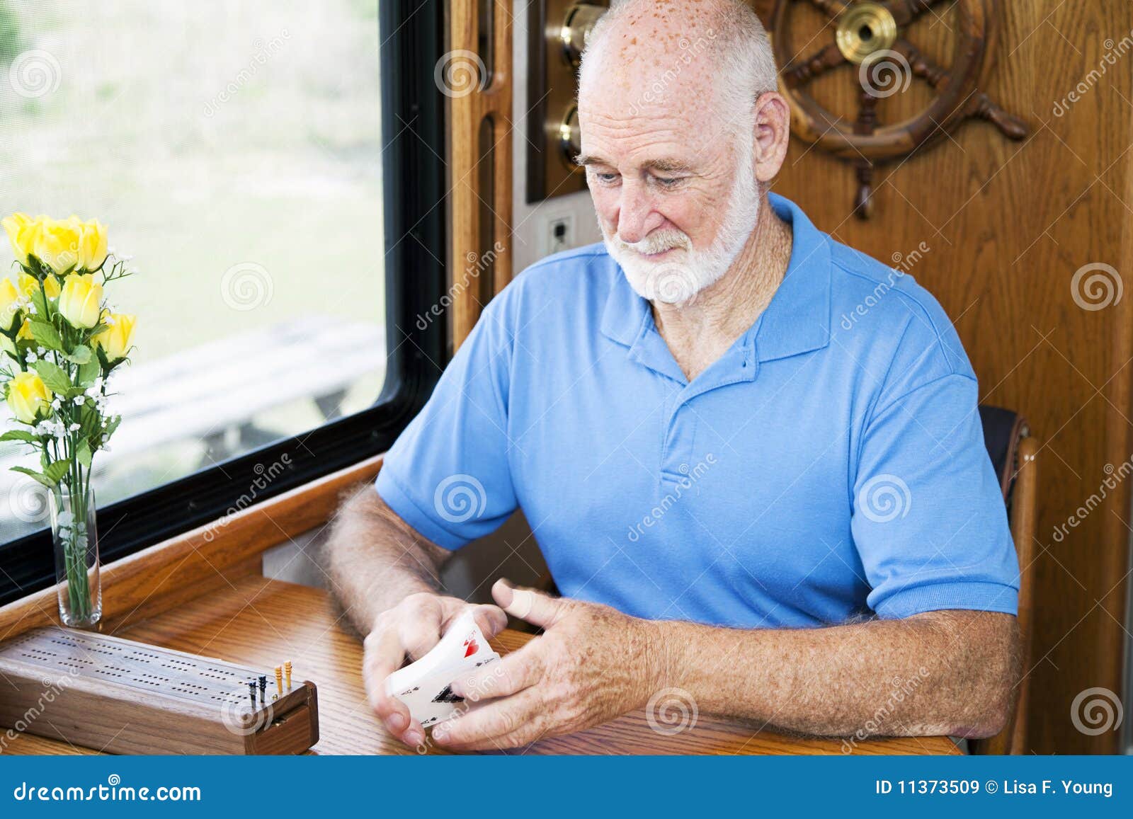 Senior Man Shuffles Cards stock image. Image of elderly - 11373509