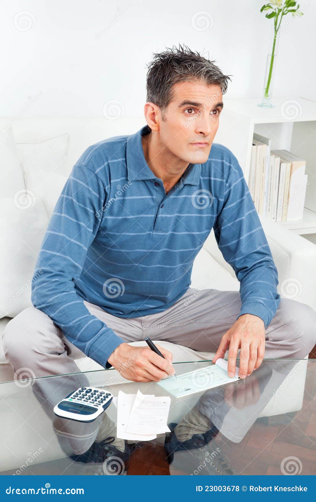 Senior man signing check stock photo. Image of doubt - 23003678
