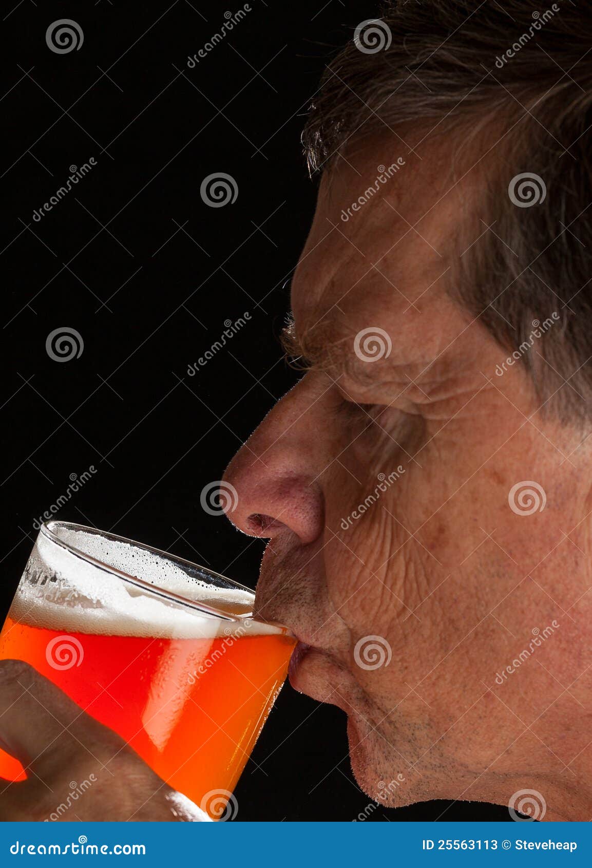Senior Man Sipping from Pint Glass Beer Stock Image - Image of backlit ...