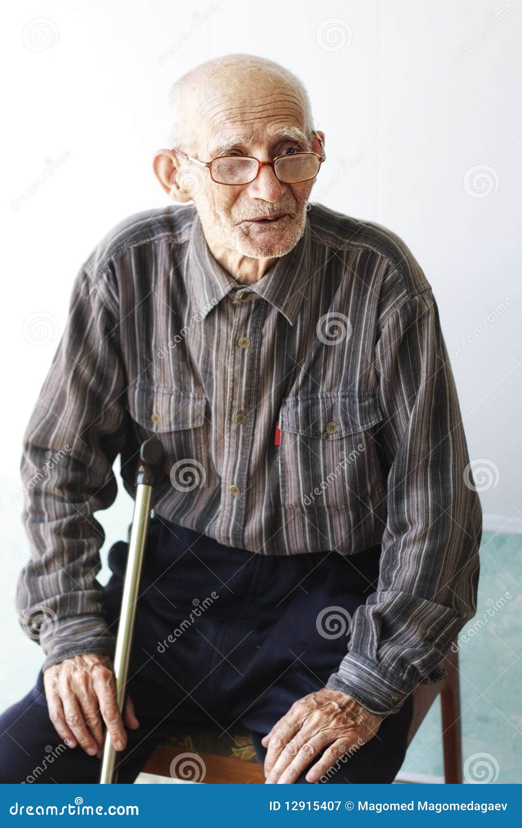 Senior Man Sitting on Chair Stock Image - Image of serene, person: 12915407