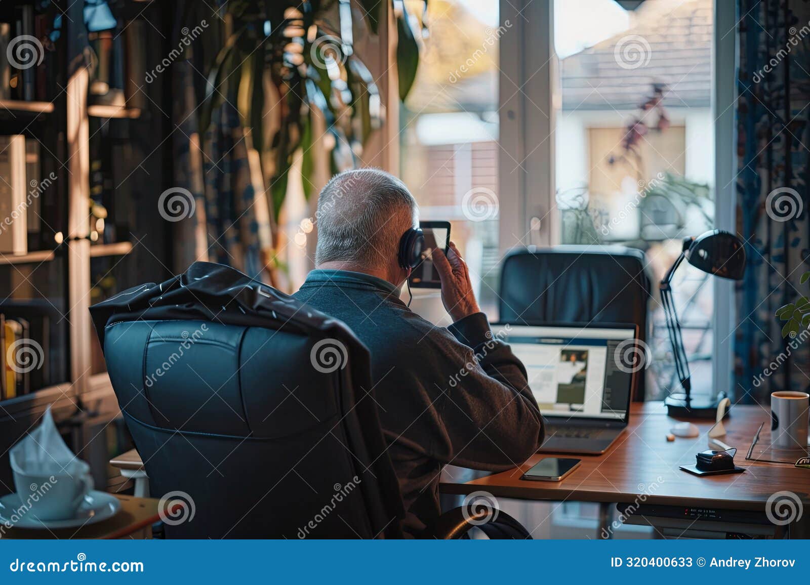 Senior Man Sitting in a Chair Taking a Selfie at Home Stock ...