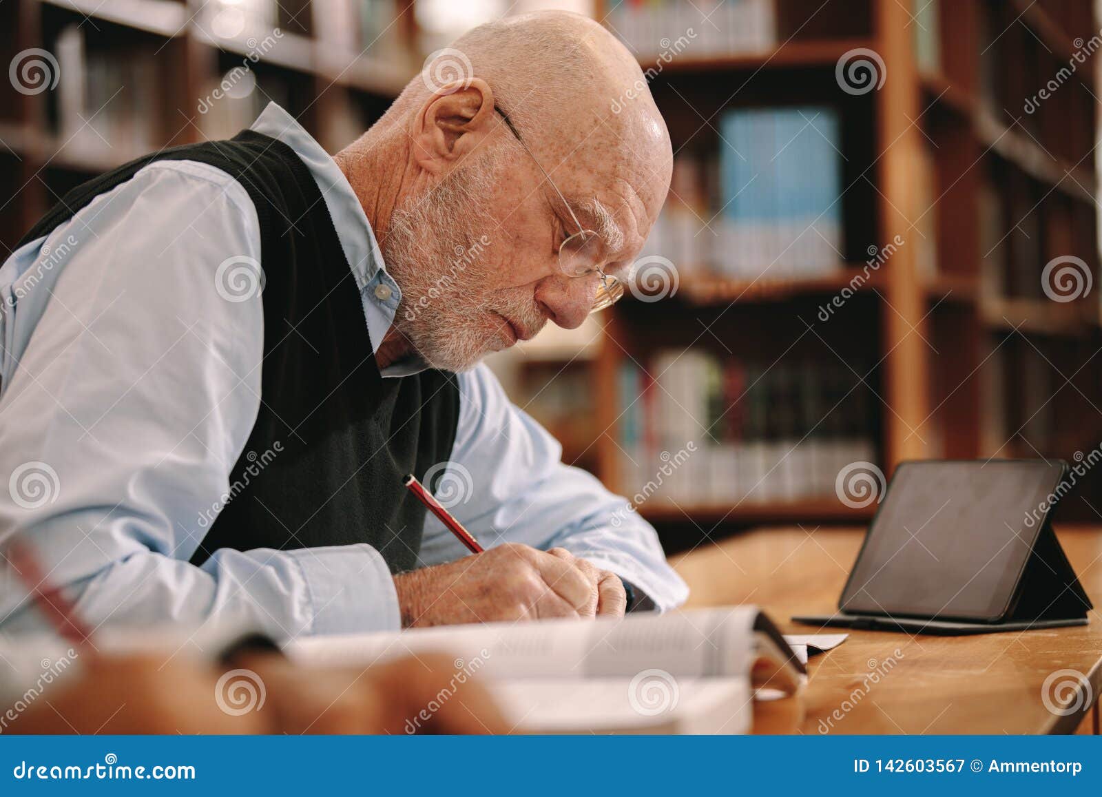 Senior Man Writing Notes Sitting in Classroom Stock Image - Image of ...
