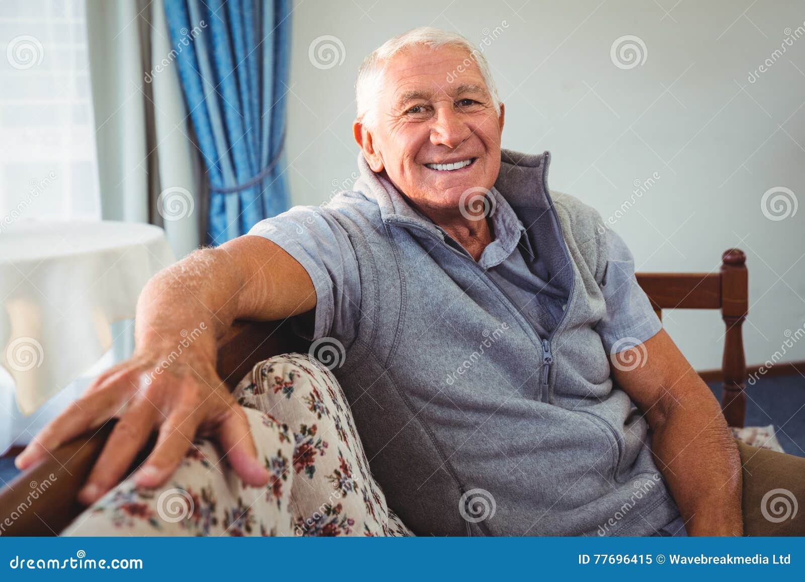Senior Man Sitting on a Couch Stock Image - Image of cheerful, retiree ...