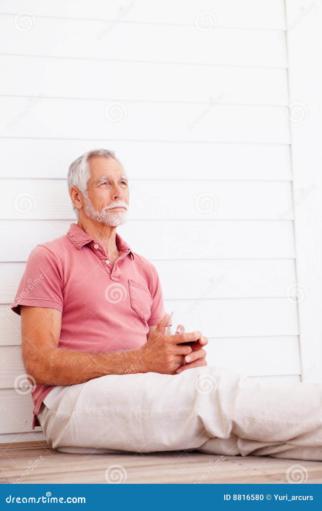 Senior Man Sitting on the Floor and Contemplating Stock Photo - Image ...