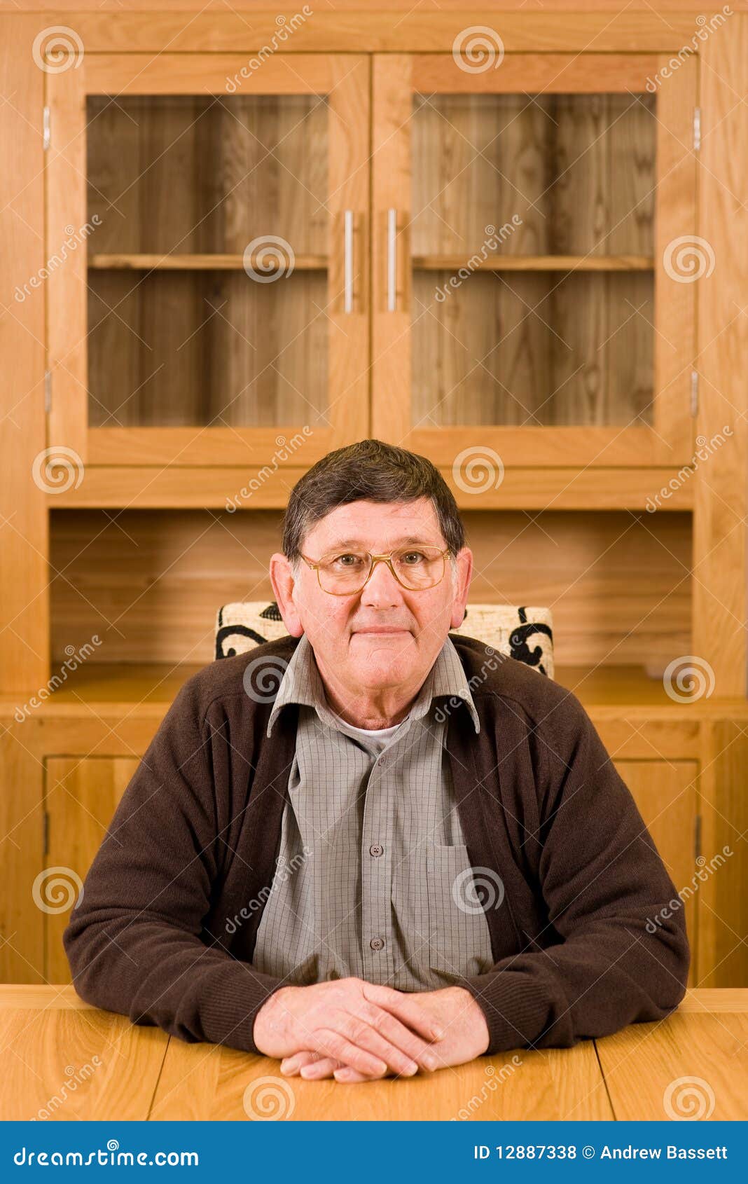 Senior Man Sitting at Table with Copyspace Above Stock Photo - Image of ...