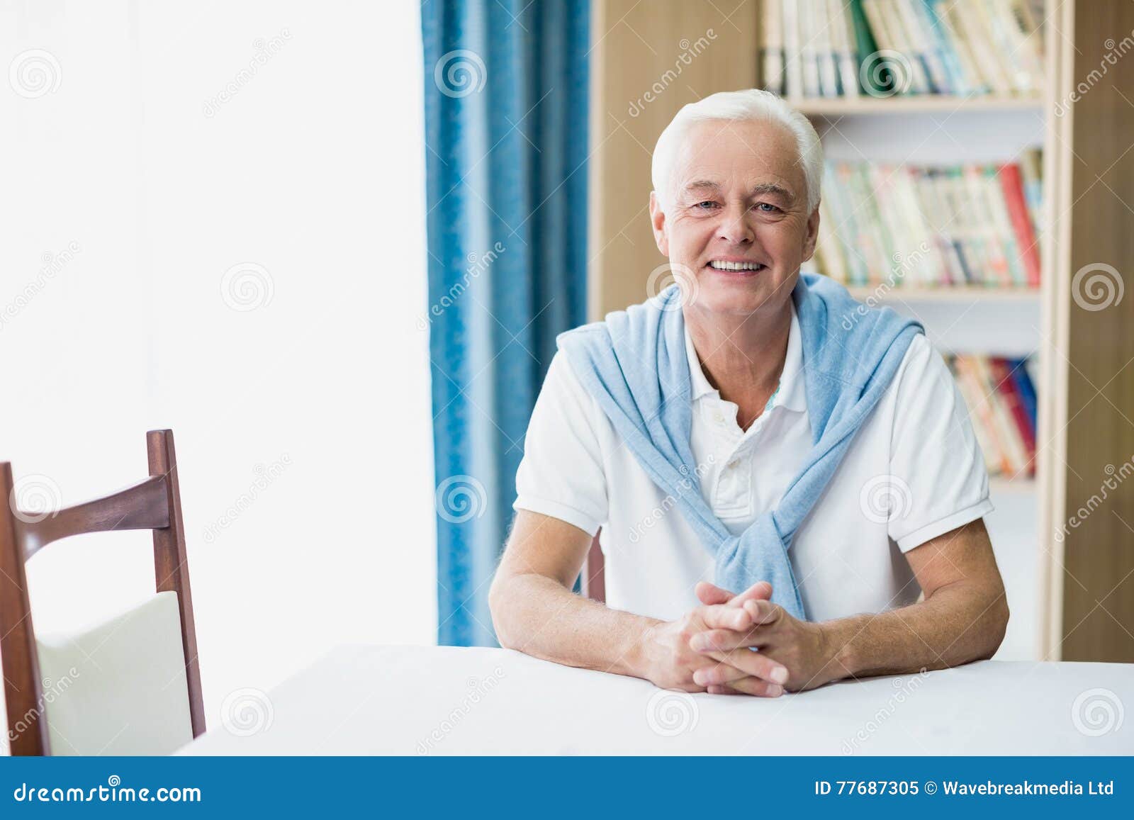 Senior Man Sitting at a Table Stock Image - Image of cupboard ...