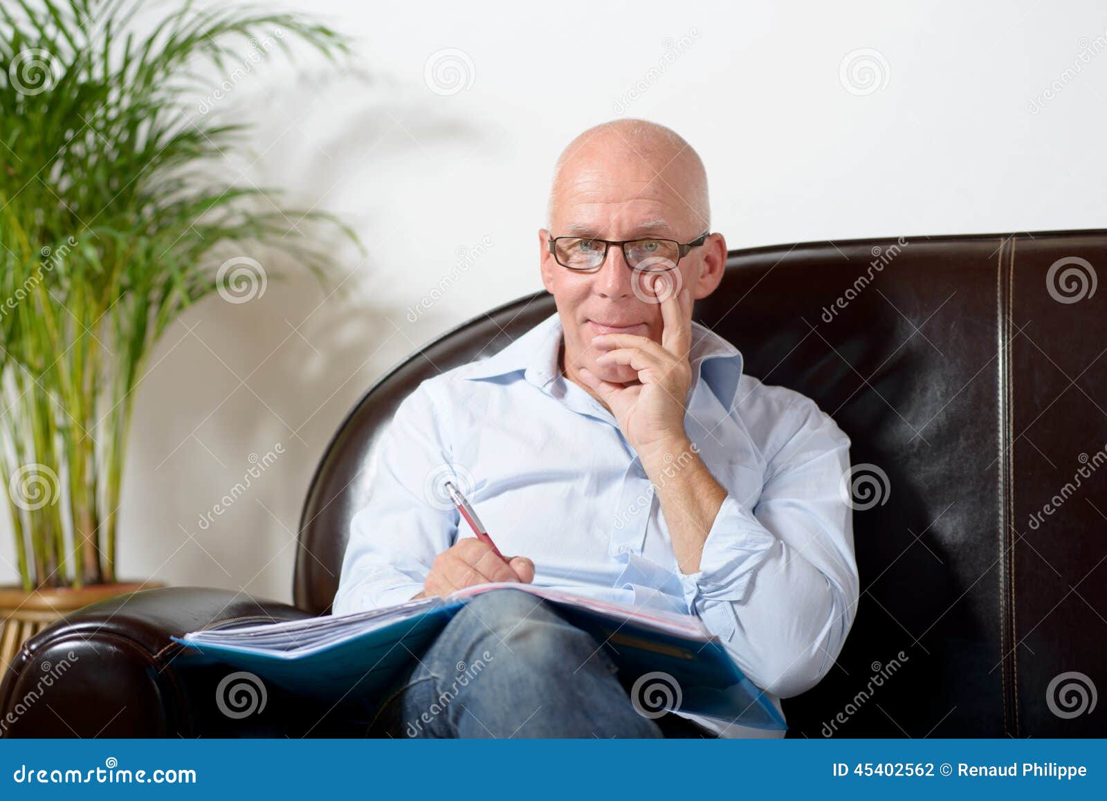 A Senior Man Sitting Taking Notes Stock Photo - Image of businessman ...