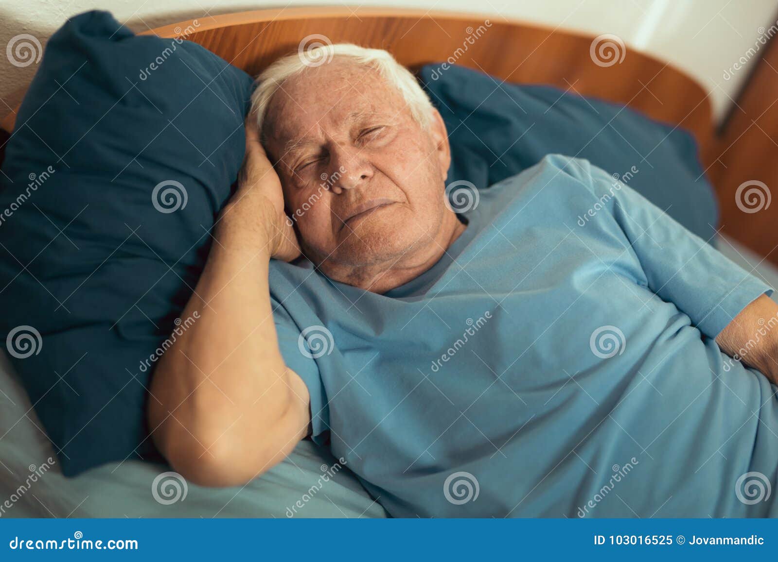 Senior man sleeping on bed stock image. Image of male - 103016525