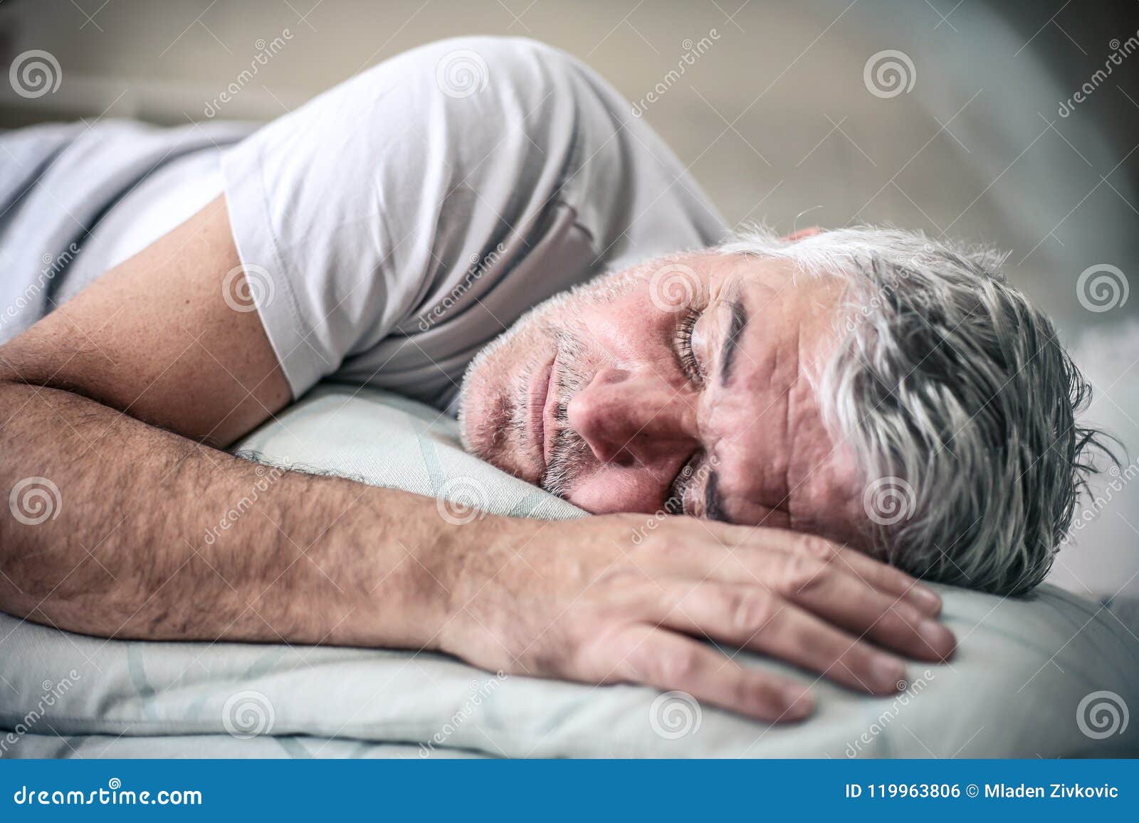 Sleepy senior man in bed. stock photo. Image of lying - 119963806