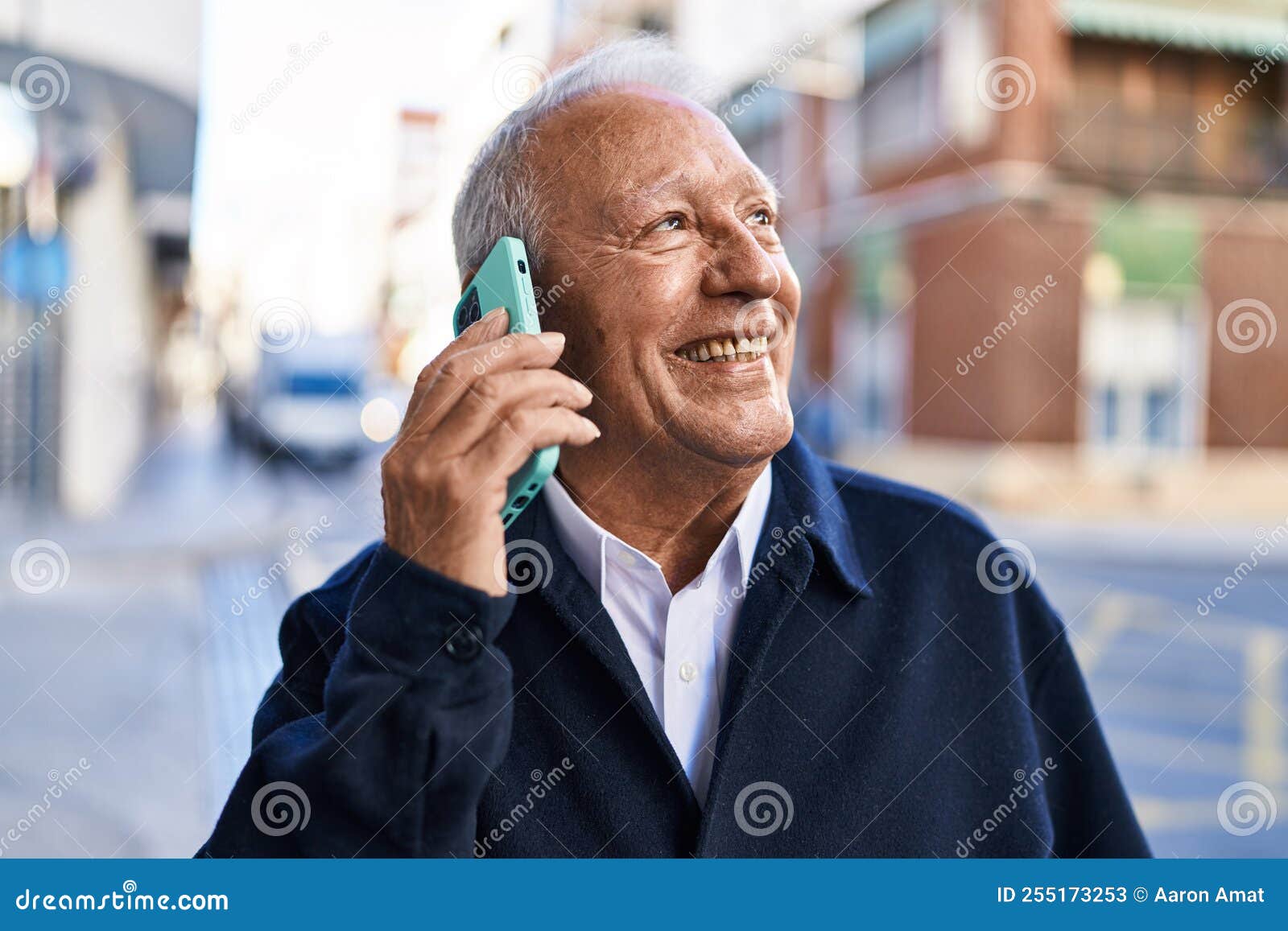 Senior Man Smiling Confident Talking on the Smartphone at Street Stock ...