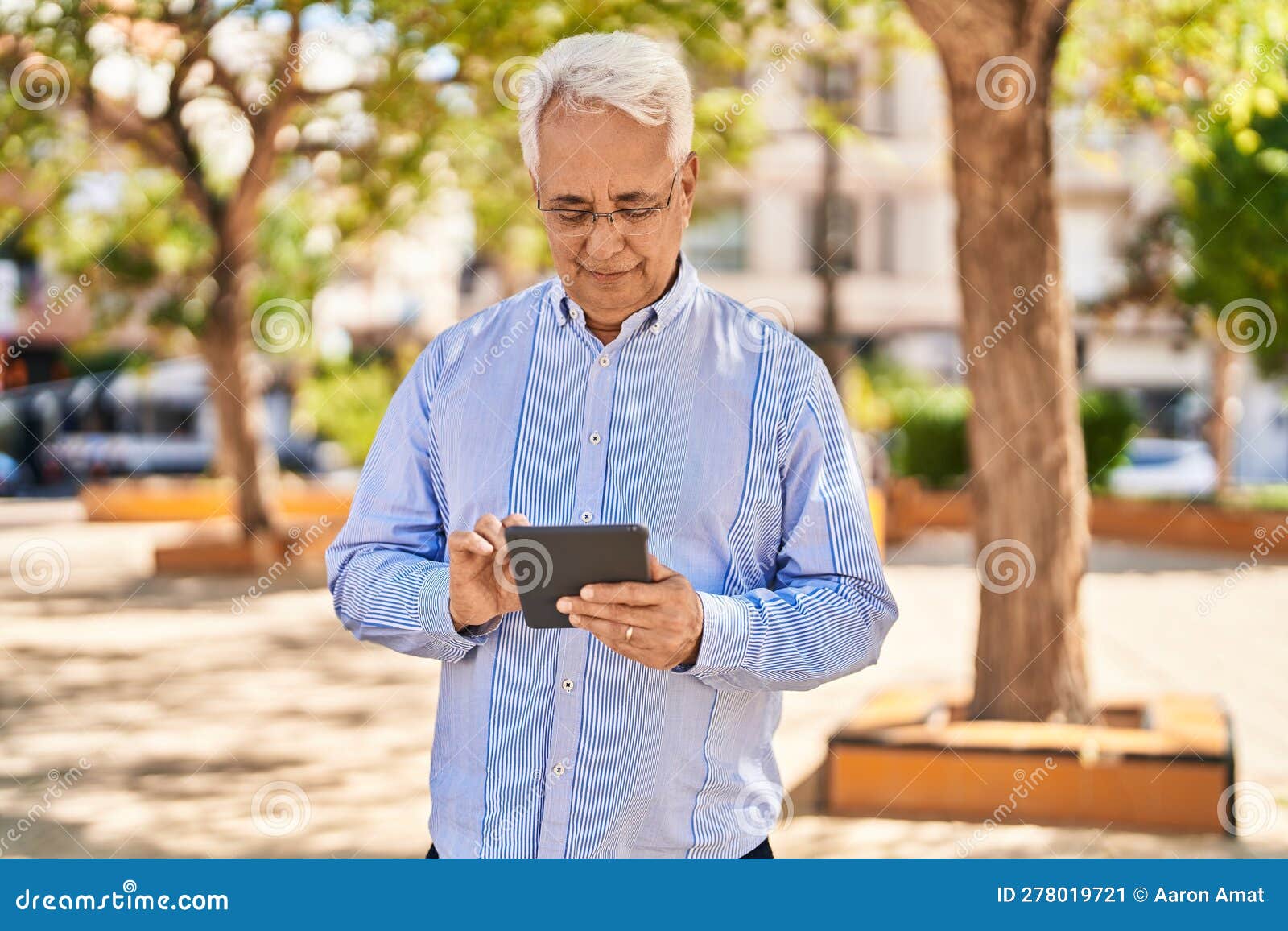 Senior Man Smiling Confident Using Touchpad At Park Stock Image Image