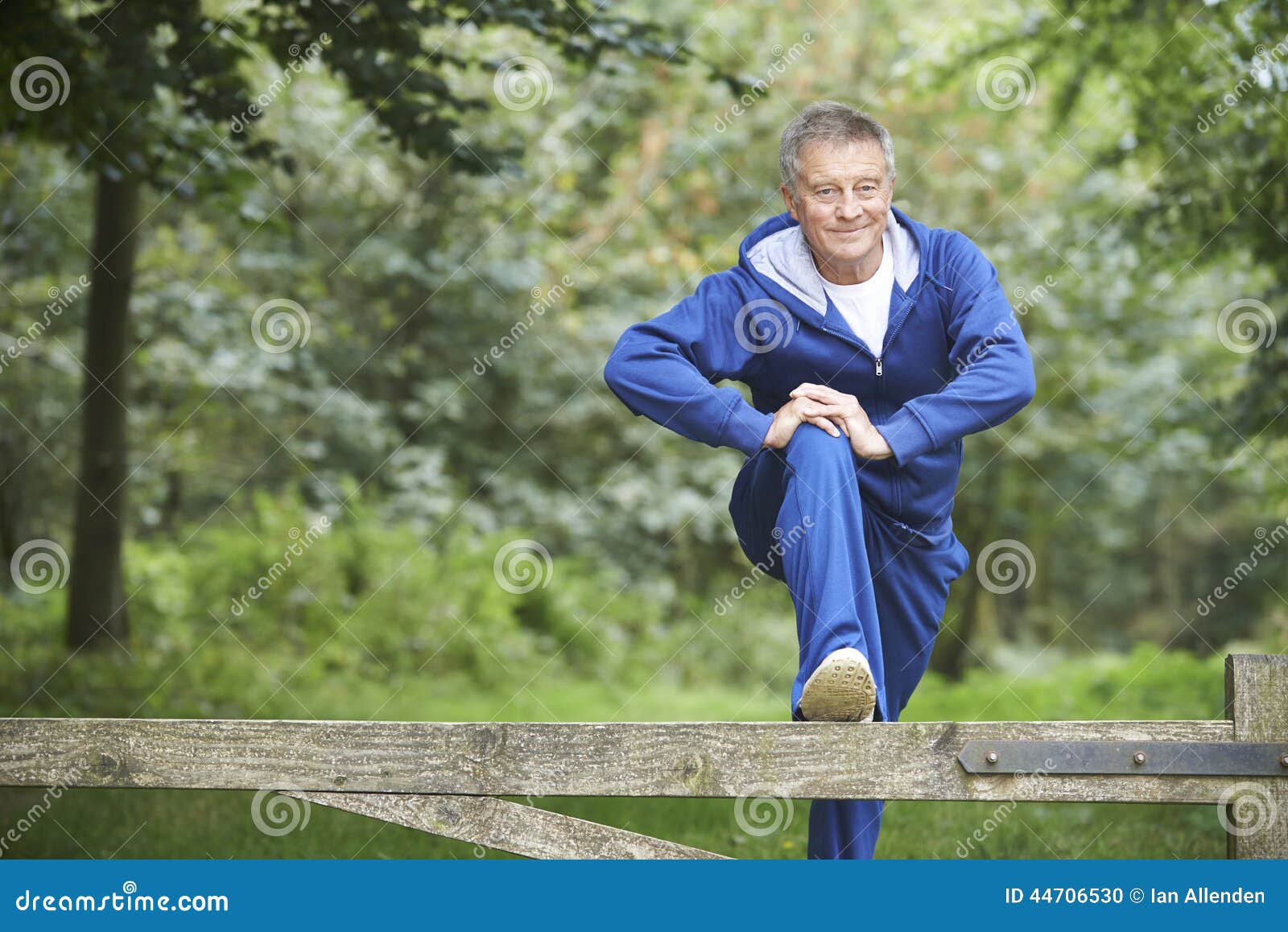 Senior Man Stretching on Countryside Run Stock Photo - Image of ...