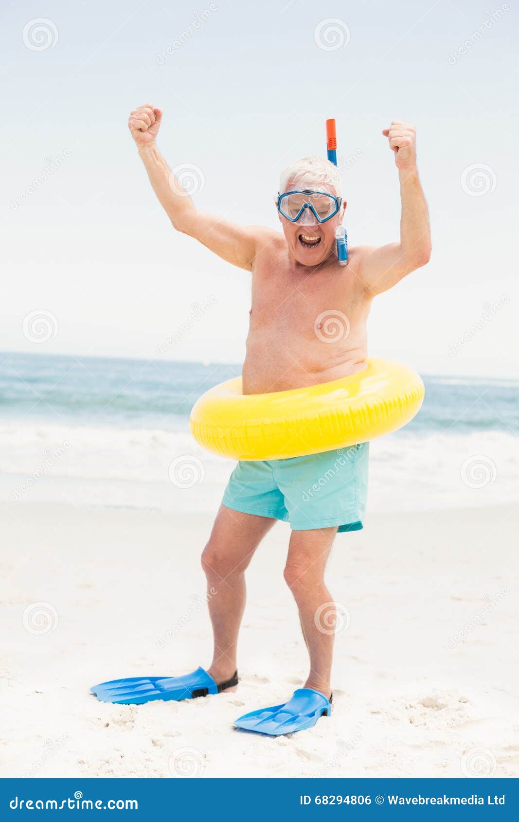 Senior Man with Swimming Ring and Flippers at the Beach Stock Photo ...