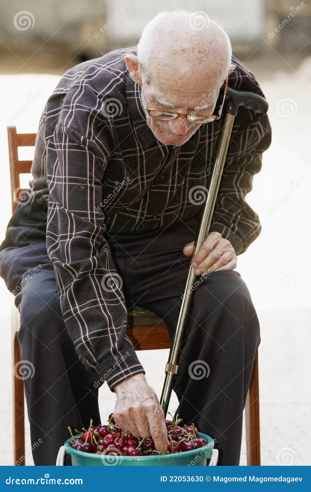 Senior man taking cherry stock photo. Image of cherry - 22053630