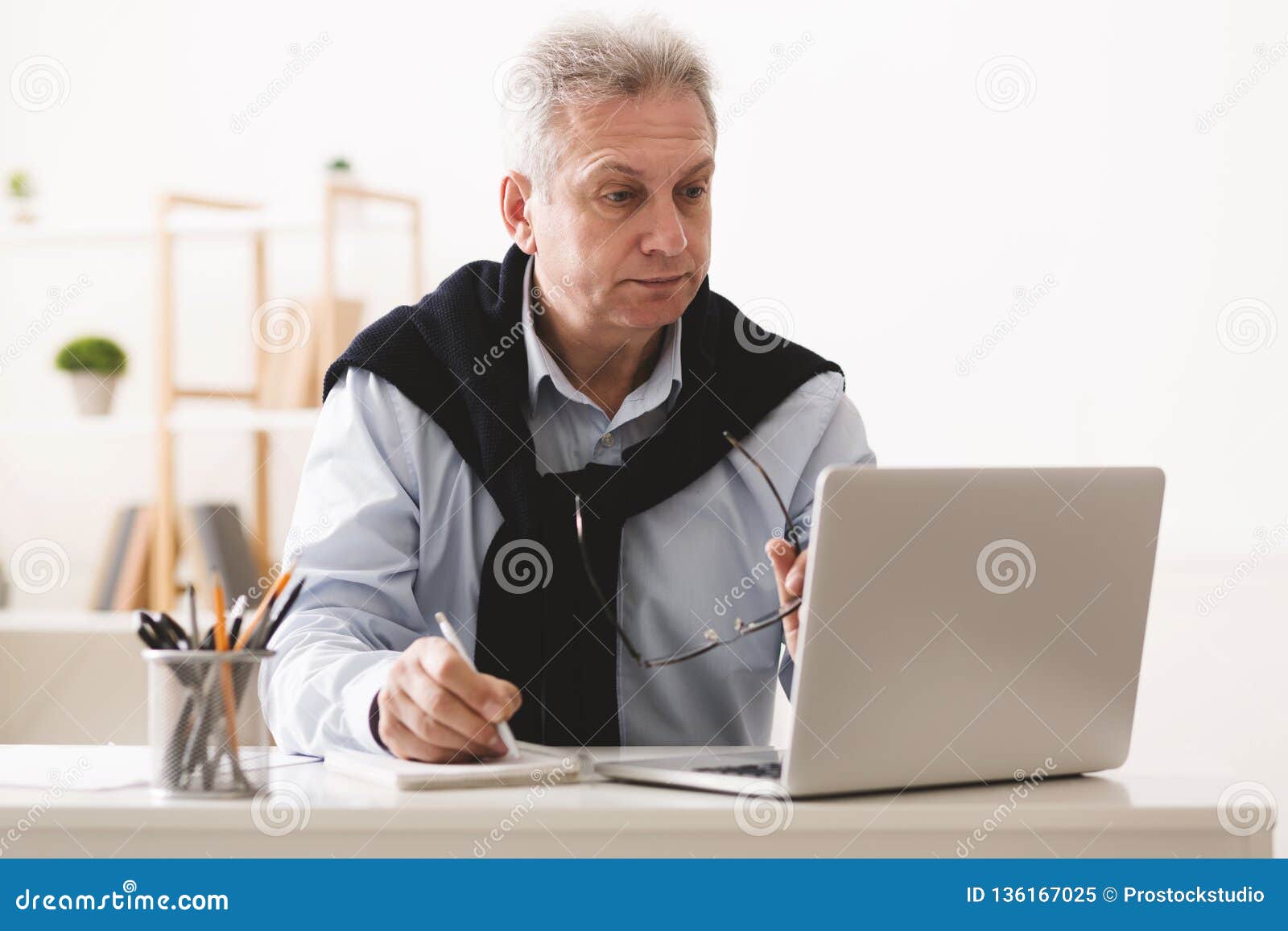 Senior Man Taking Notes in Front of Laptop Stock Image - Image of male ...