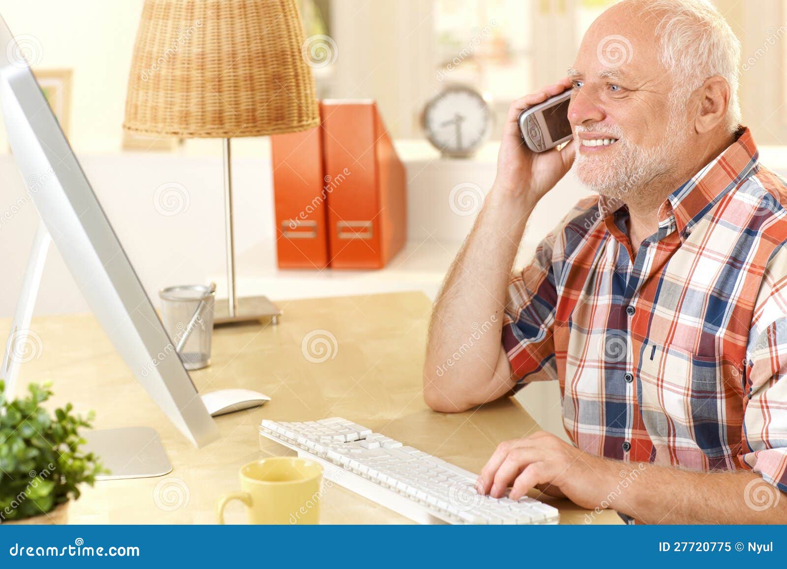 Senior Man Talking on Cellphone, Using Computer Stock Image - Image of ...