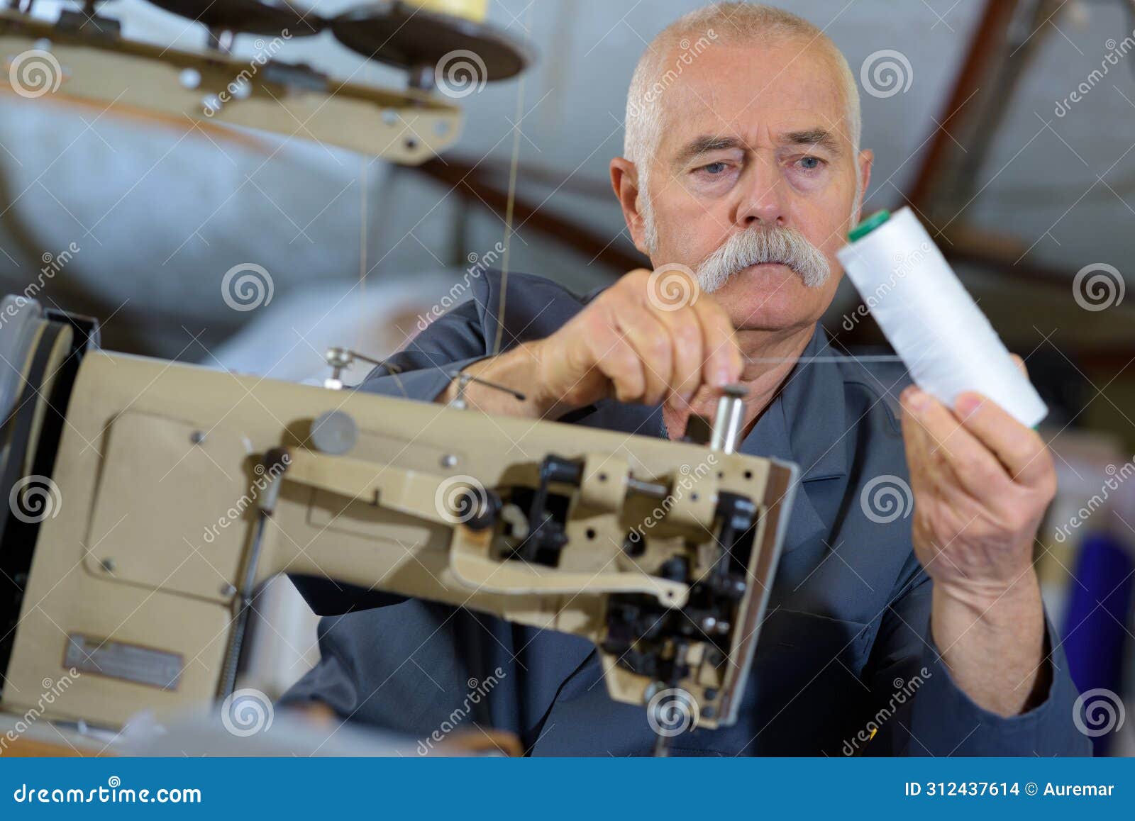Senior Man Threading Up Industrial Sewing Machine Stock Photo - Image ...