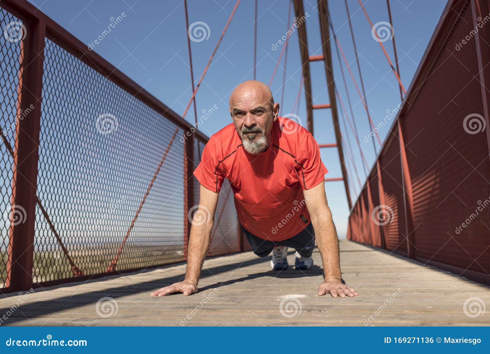 Senior Man Training and Stretching on Bridge, Push Ups Stock Photo ...