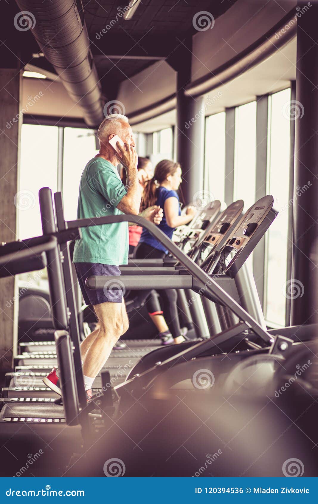 Talk on phone at gym. stock photo. Image of lifestyles - 120394536