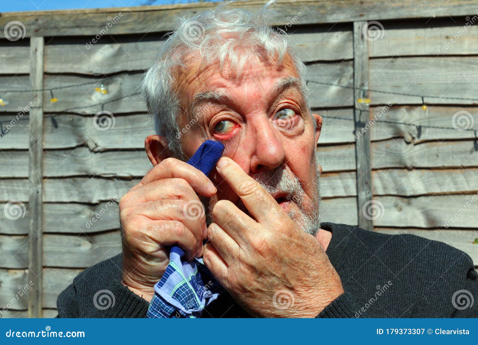 Senior Man Something in His Eye. Stock Image - Image of remove, pulling ...