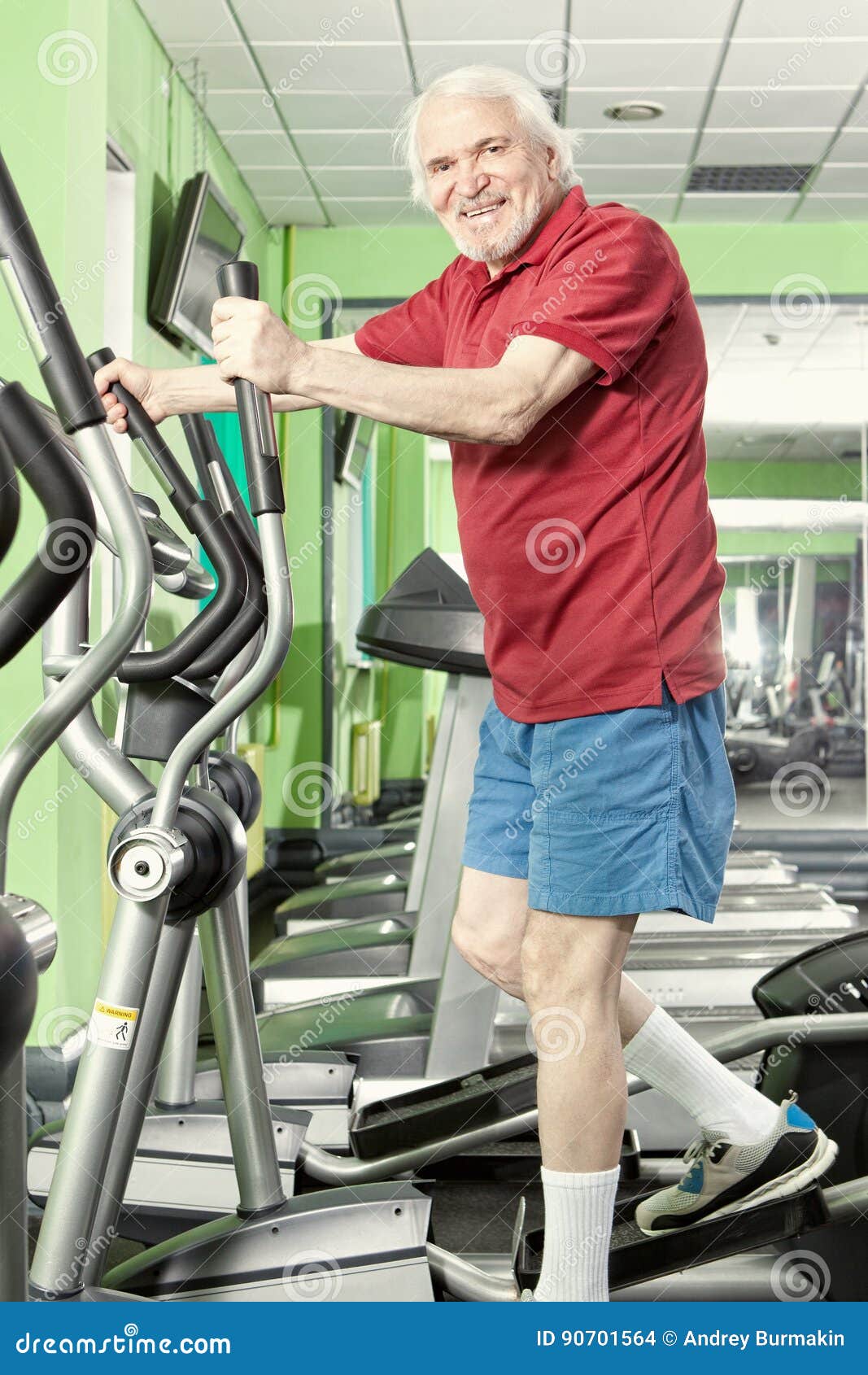 Senior Man Uses Elliptical Cross Trainer Stock Photo - Image of ...