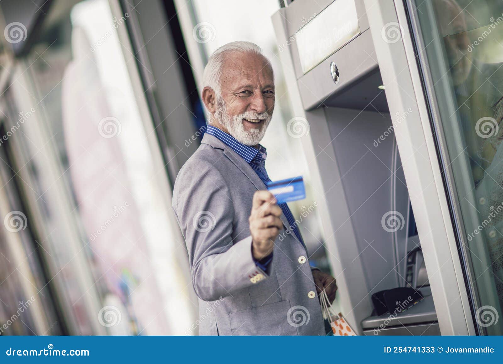 Senior Man Using ATM Machine with Credit Card Stock Image - Image of ...