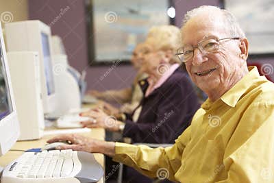 Senior man using computer stock photo. Image of elderly - 9004052