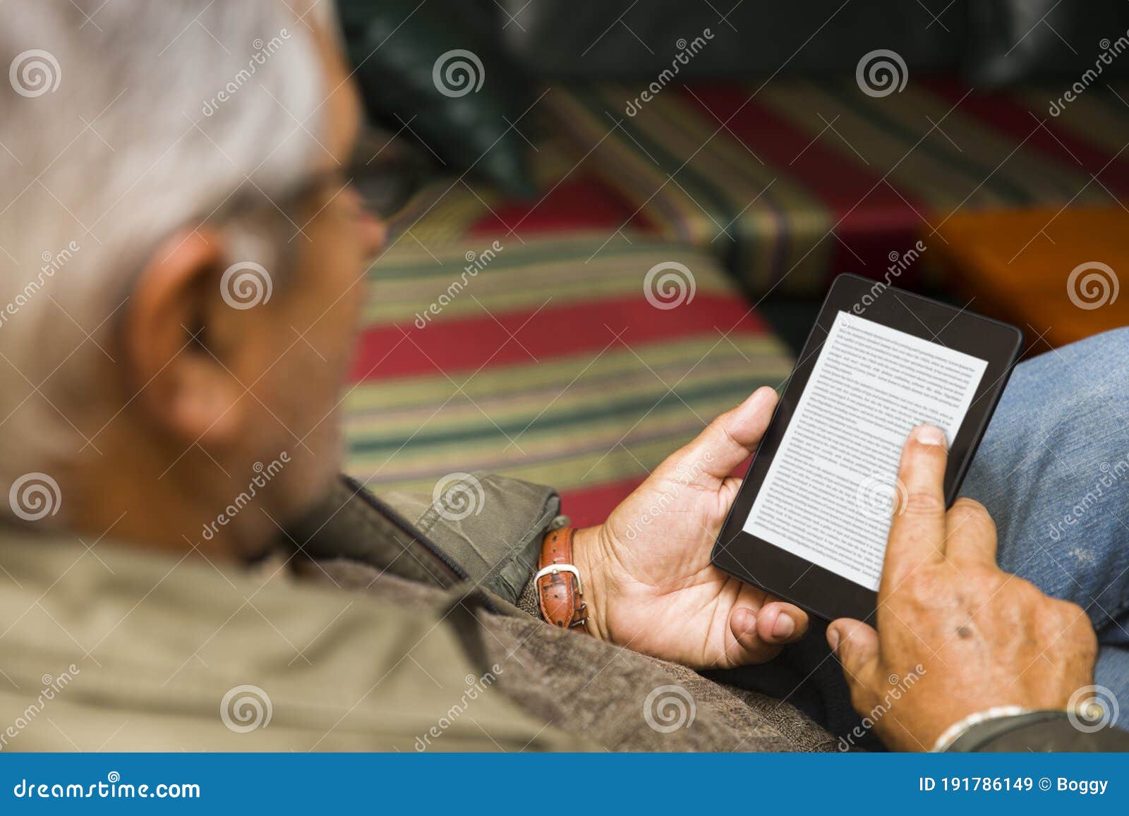 Senior Man Using an Ebook Reader Stock Image - Image of read, interior ...